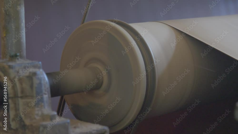 Paper and pulp mill processes a huge sheet of cardboard. An industrial ...
