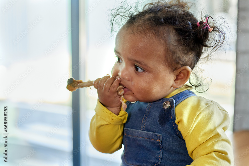 baby eating chicken bone Stock Photo | Adobe Stock