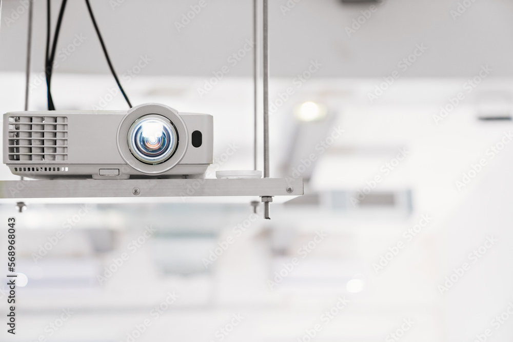 The video projector is suspended from the ceiling to show presentations ...