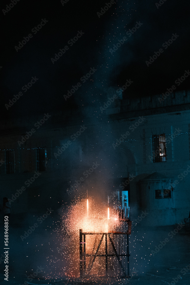Fireworks going from the launching platform leaving a trail of sparks ...