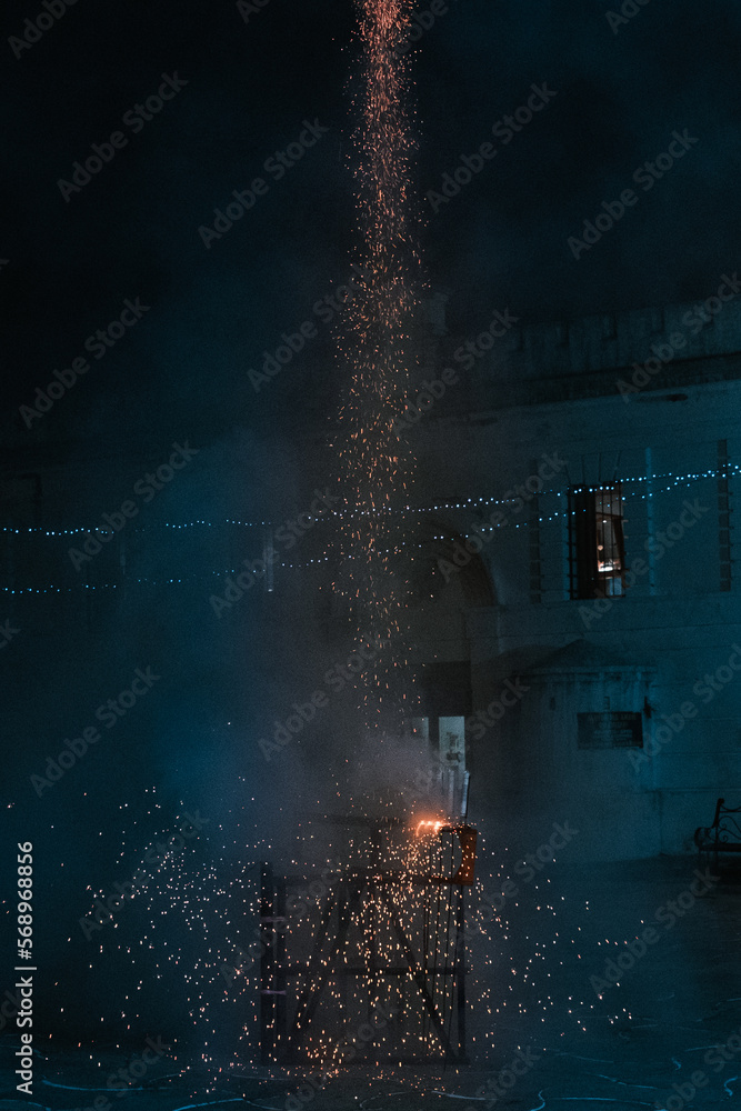 Fireworks going from the launching platform leaving a trail of sparks ...