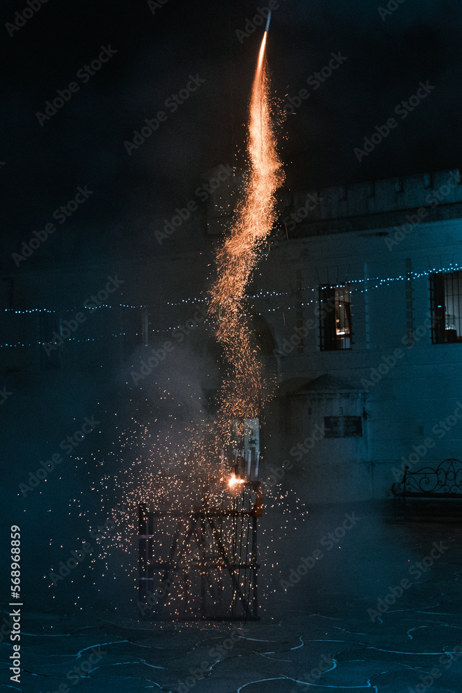 Fireworks going from the launching platform leaving a trail of sparks ...