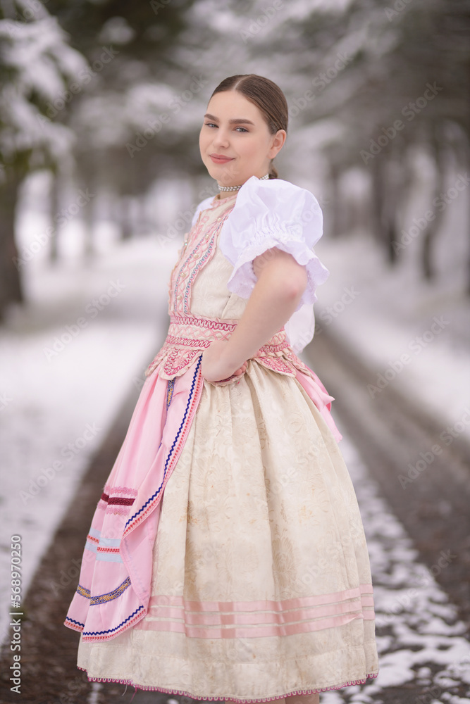 Young beautiful slovak woman in traditional dress. Slovak folklore ...