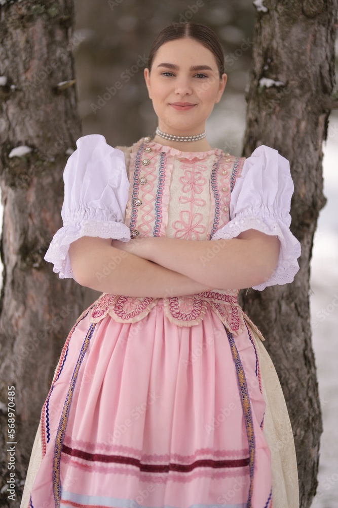 Young beautiful slovak woman in traditional dress. Slovak folklore ...