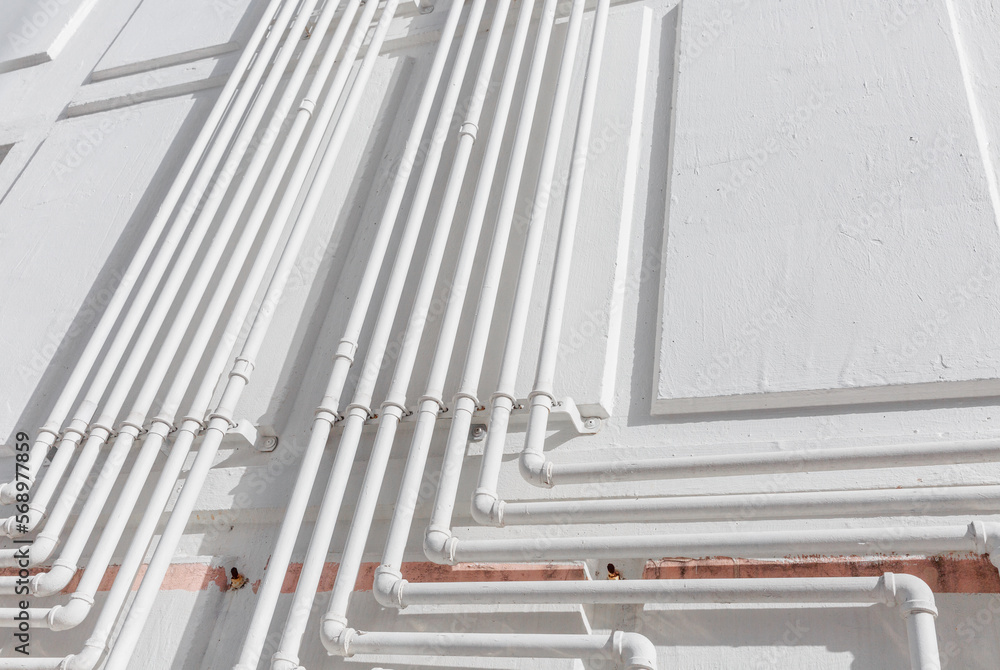 Foto de Several gas pipes installed on the wall of a building. do Stock ...