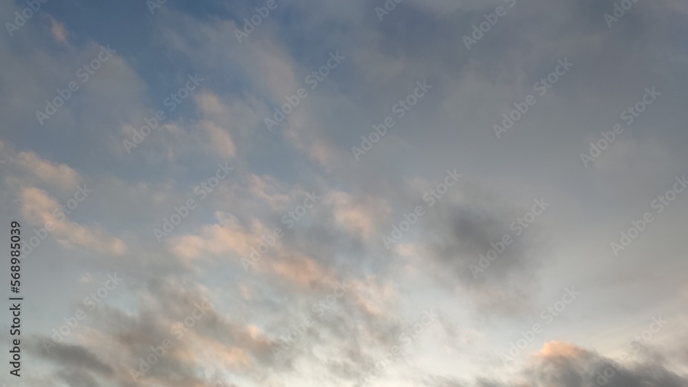 Foto de Cloudy sky with clouds. Low cumulus clouds of various shapes ...