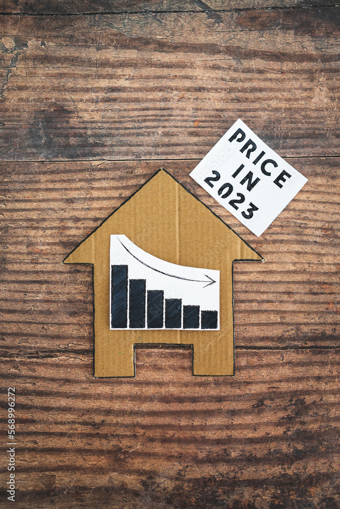 cardboard house with chart showing prices potentially going down in ... cardboard house with chart showing prices potentially going down in ...