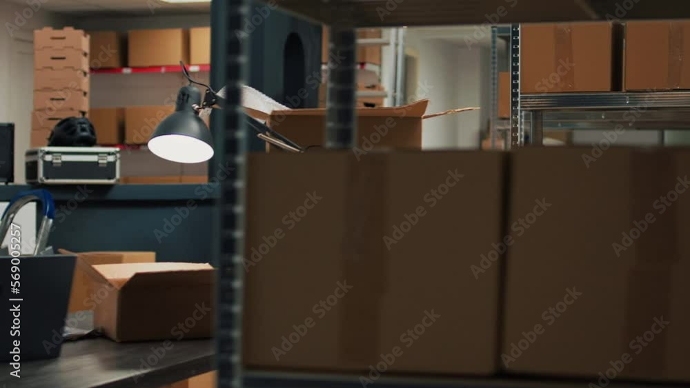 Empty storehouse with office desk to work on inventory and logistics ...