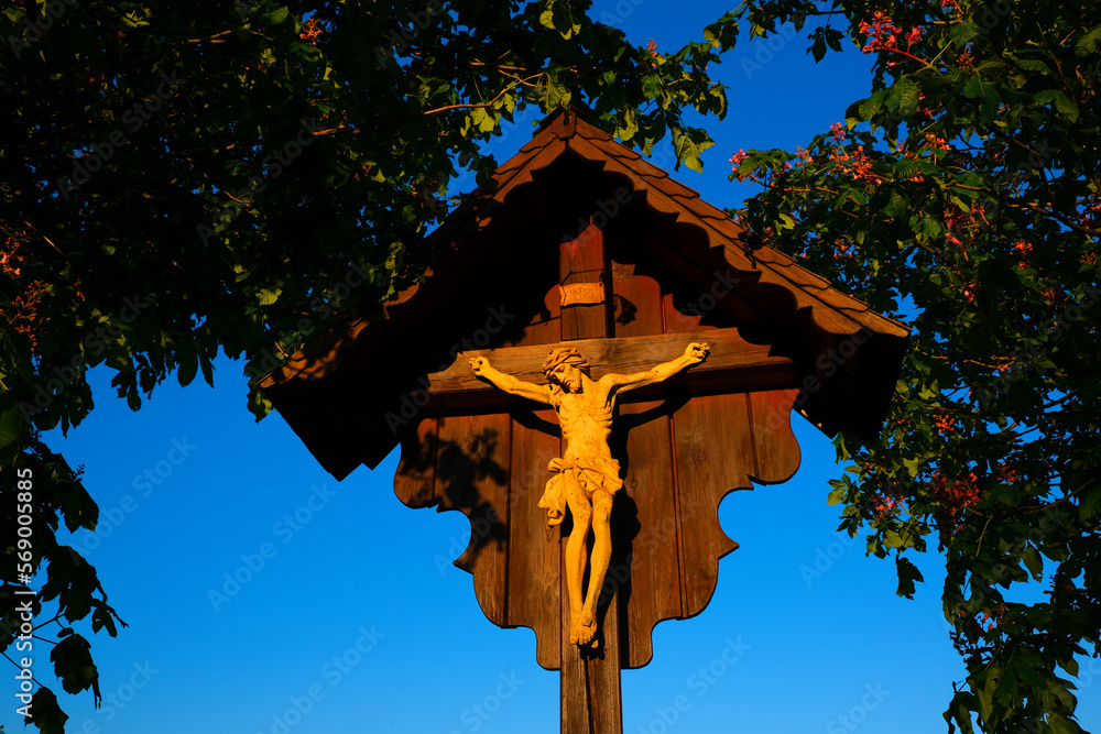 Jesus Christ on the cross in blooming chestnut trees.Christian and ...