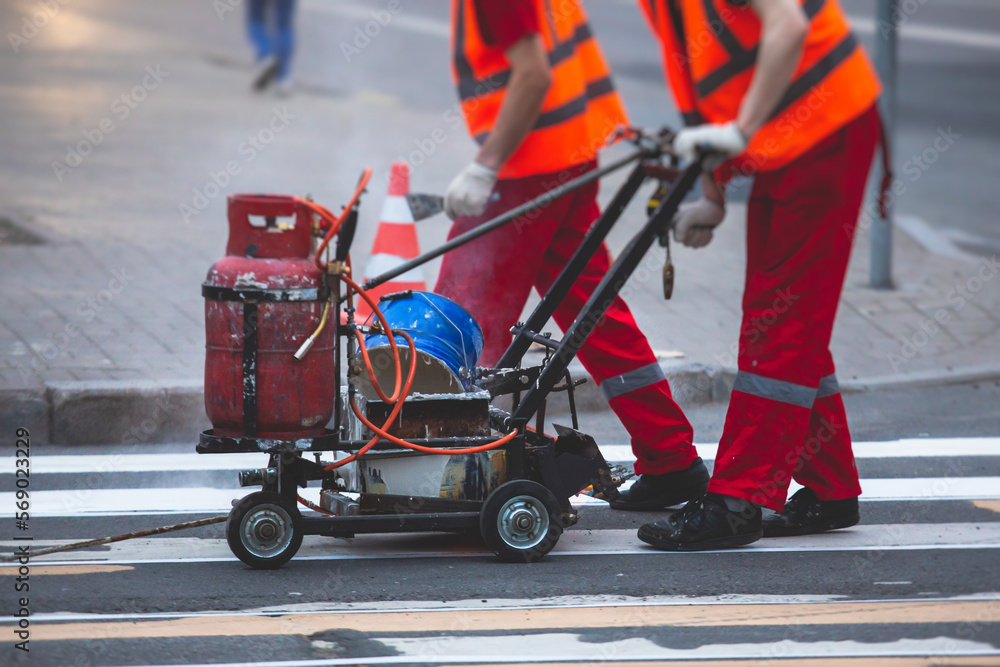 Process of making new road surface markings with a line striping ...