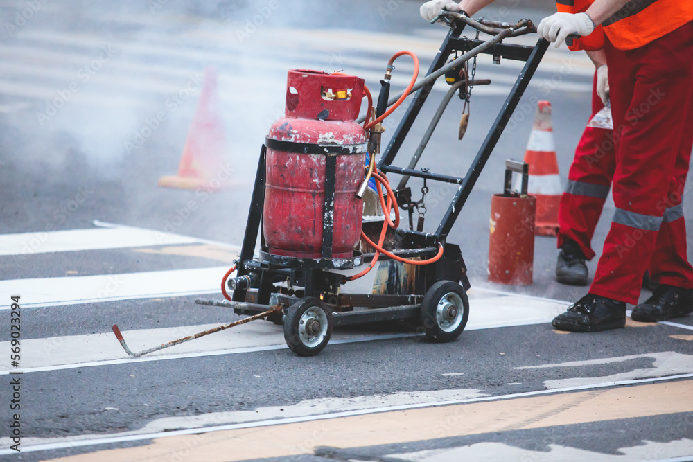 Process of making new road surface markings with a line striping ...