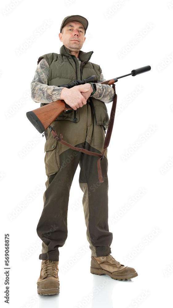 Fifty-year-old man in hunting uniform posing in studio, isolated on ...