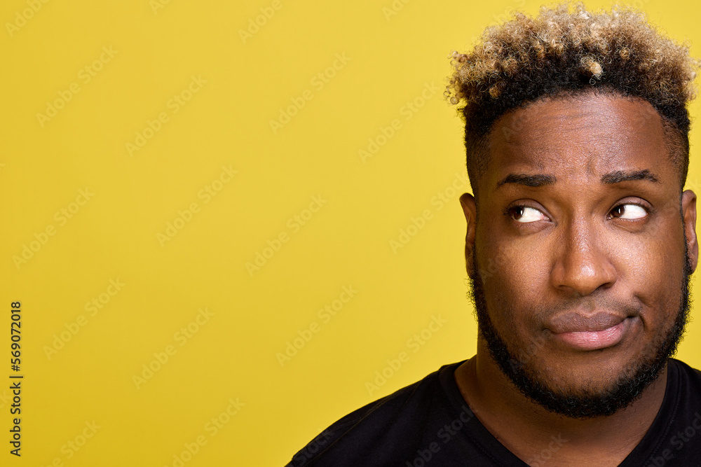 Ddoubting guy looks away with a smirk. A dark-skinned man with a beard ...