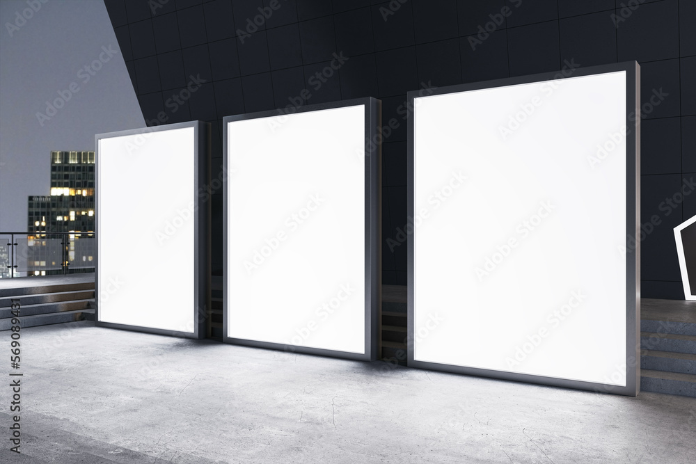 Outdoor advertising concept with perspective view on three blank white ...
