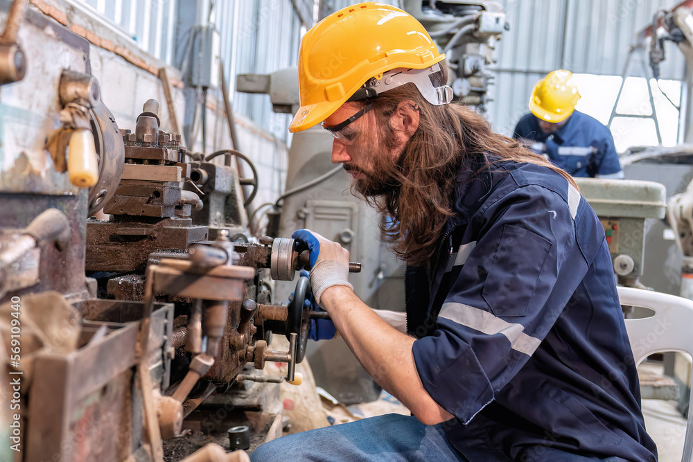 In robotic maintenance repair engineer lathe machine fabricate part and ...