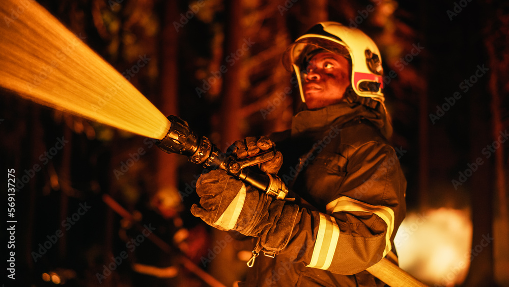 Experienced Back Firefighter Extinguishing a Wildland Fire Deep in a ...