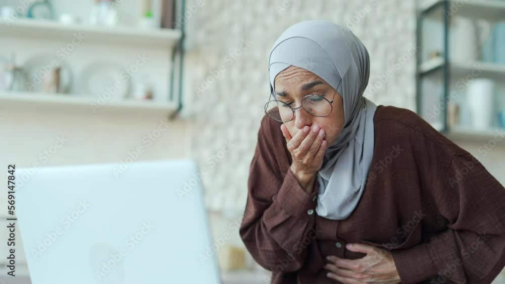 Vídeo do Stock: Young Muslim woman with poisoning or intoxication feels ...