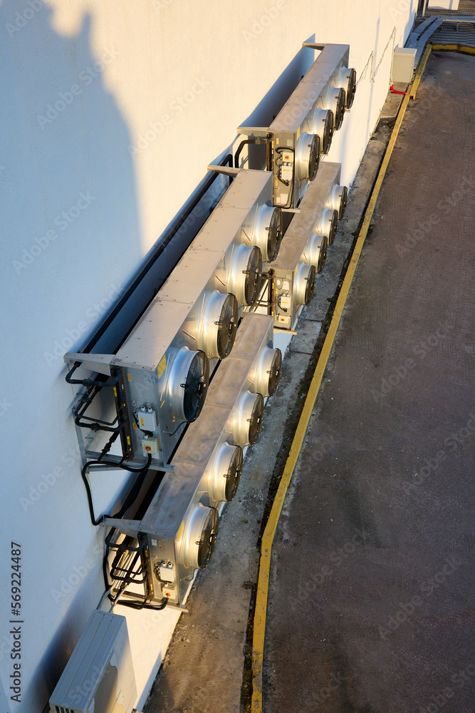 Large external unit of the air conditioning system, fixed on the wall ...