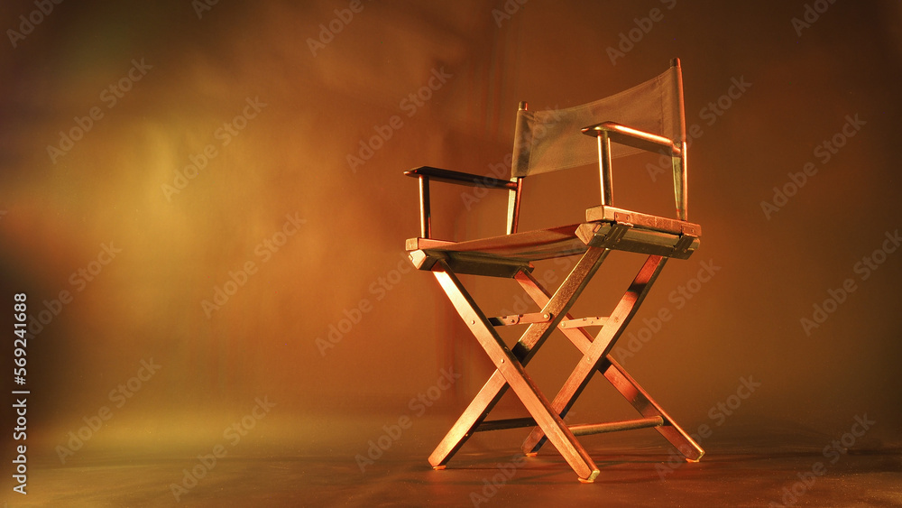 Black Director chair isolated in yellow light color with black ...