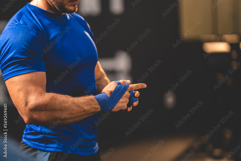 Closeup of hands of young male athlete trainer determined to workout ...