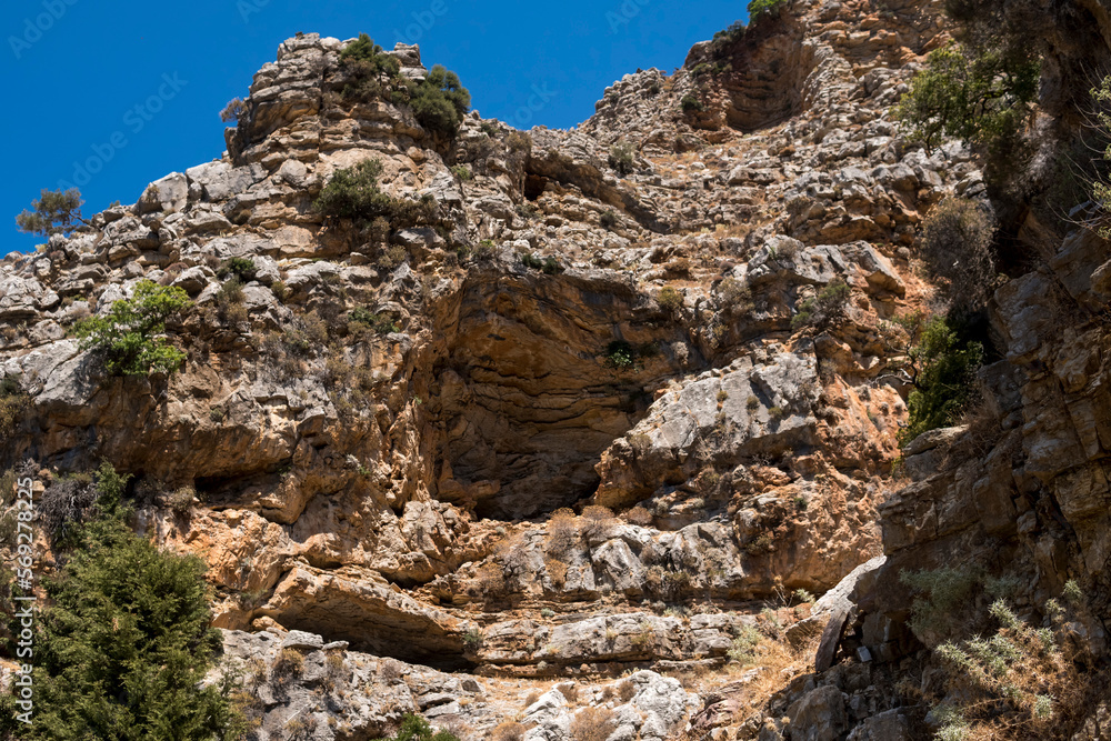 Cave on steep slope of a mountains at Rhodes Island Stock Photo | Adobe ...
