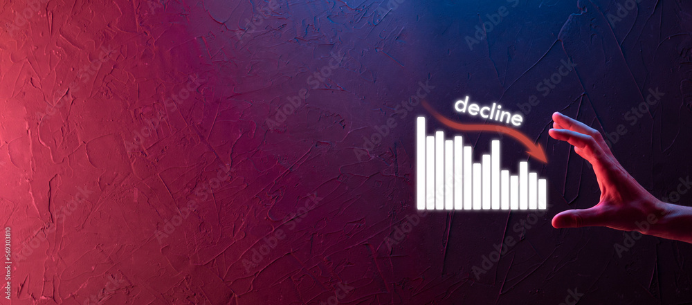 Business man holding holographic graphs and stock.Decline, decrease ...