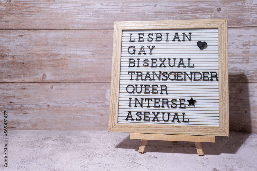 LGBTQIA description frame on Rainbow LGBTQIA flag made from silk ...