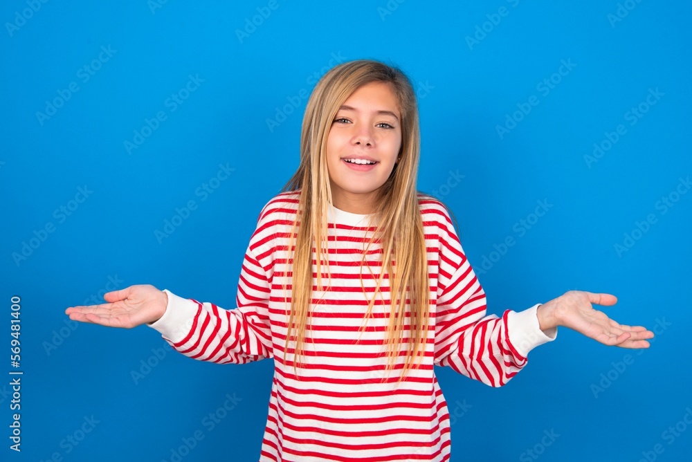 So what? Portrait of arrogant caucasian teen girl wearing striped shirt ...