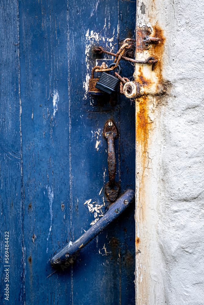 Double Padlocked Door Of A Fishermans Cottage In Staithes, North ...
