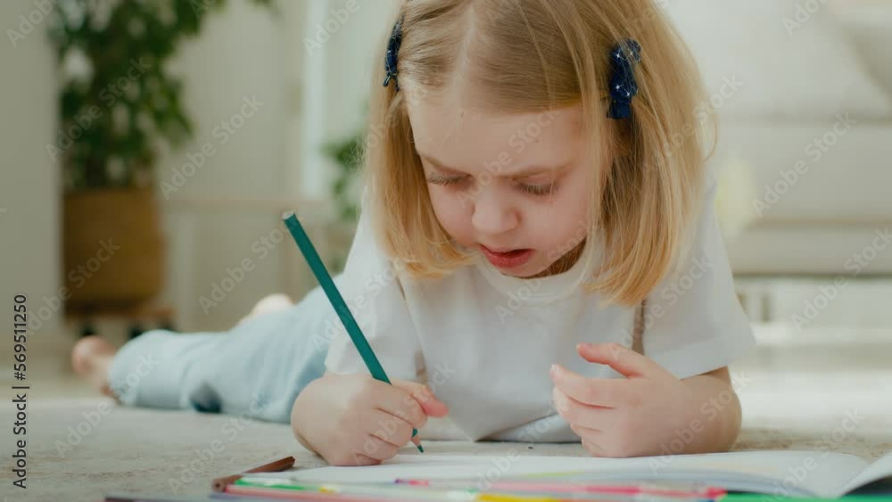 Cute creative funny preschool Caucasian little kid girl draw with ...