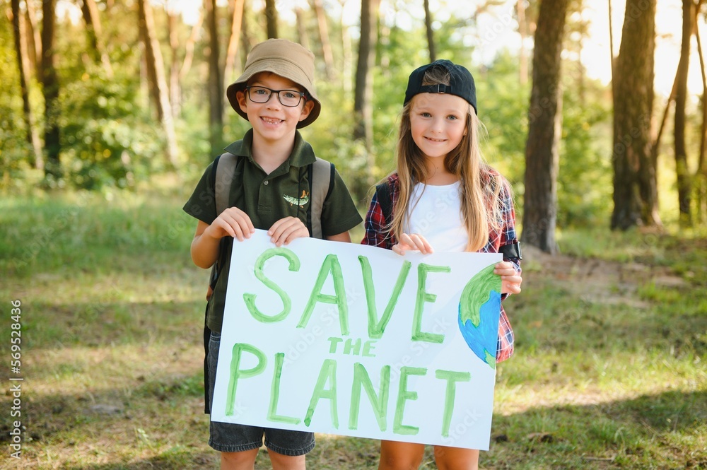 Children are holding a poster: Save the planet. Earth Day. Let's save ...