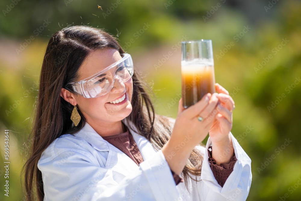 Soil test, female agricultural scientist conducting a soil test in a ...