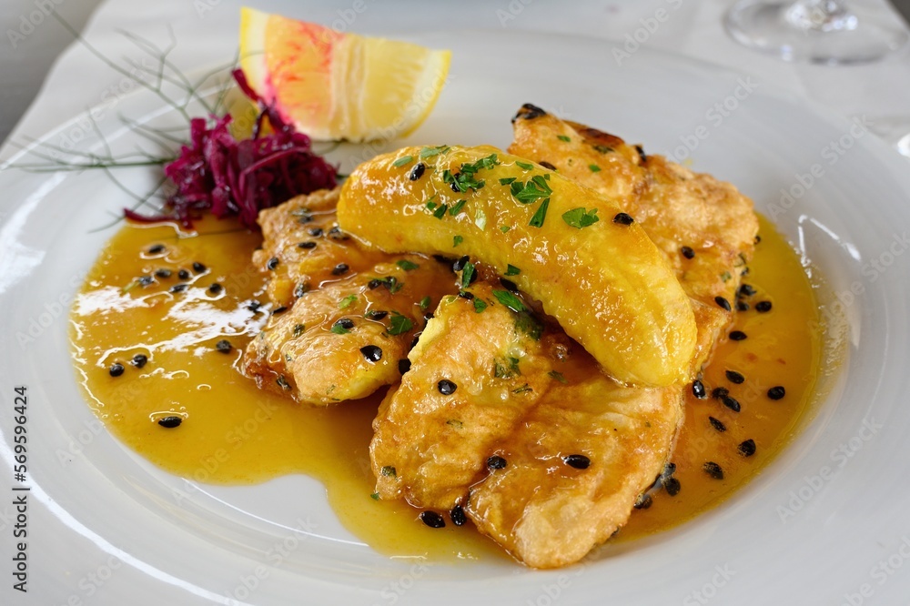 Filete de Espada with banana and passion fruit sauce. The black ...