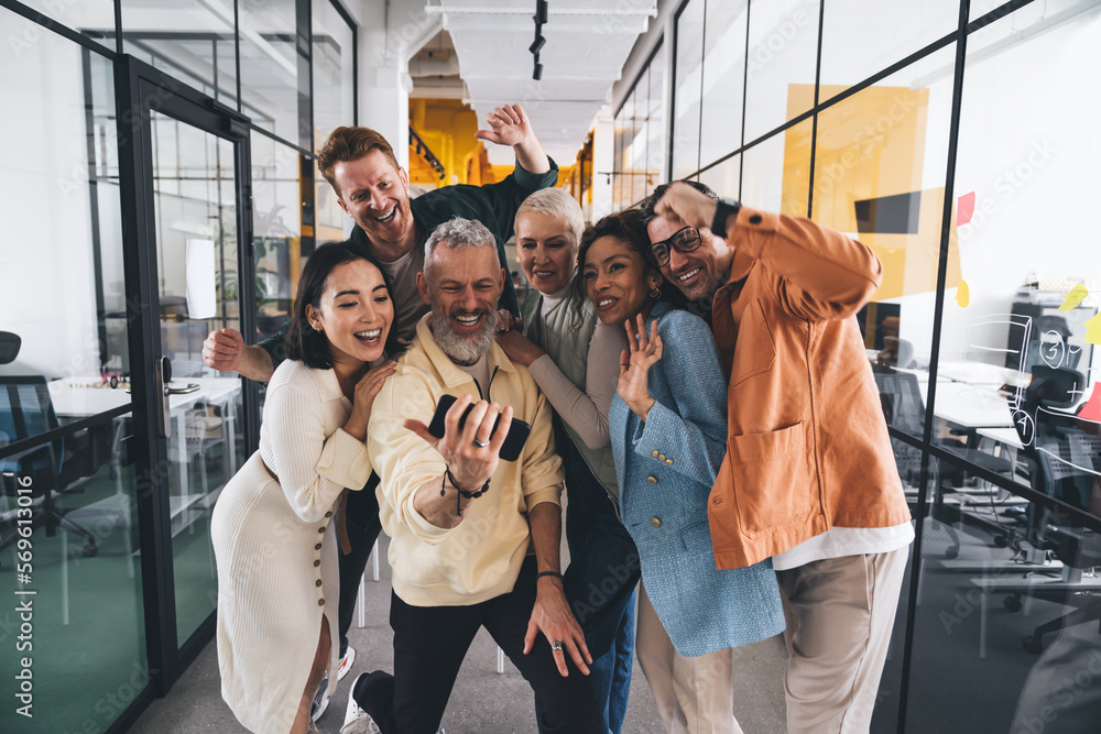 Positive multiethnic group of friends taking selfie together Stock ...