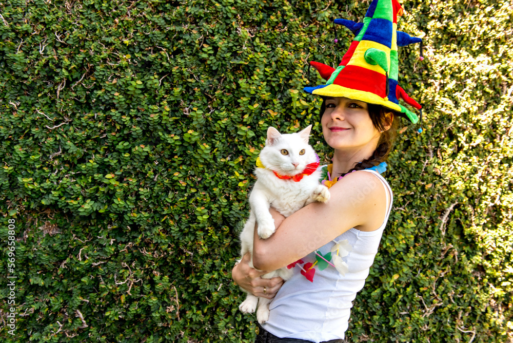 Brazilian pet carnival, beautiful white cat and her owner in carnival ...