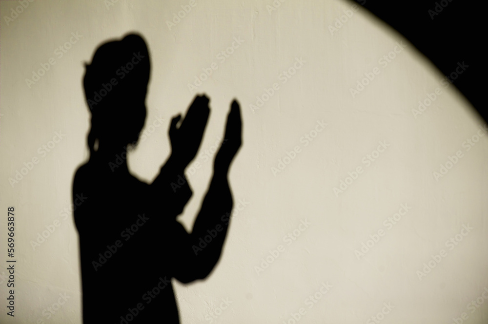 silhouette of Religious muslim islam man lift two hand for praying to ...