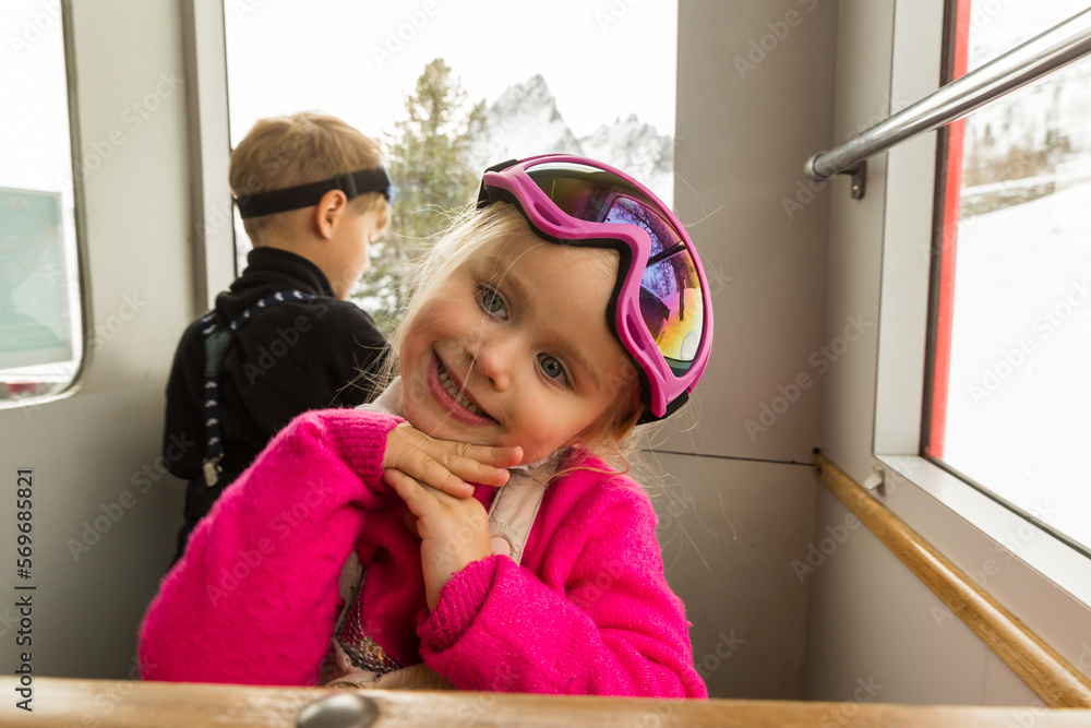 Little girl looking out of the window of train during travel on ...