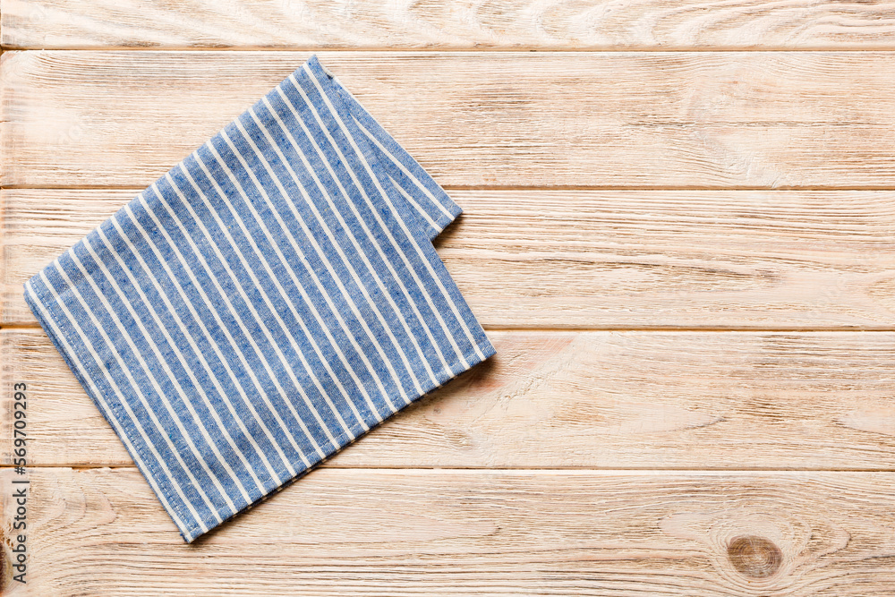 top view with blue kitchen napkin isolated on table background. Folded ...