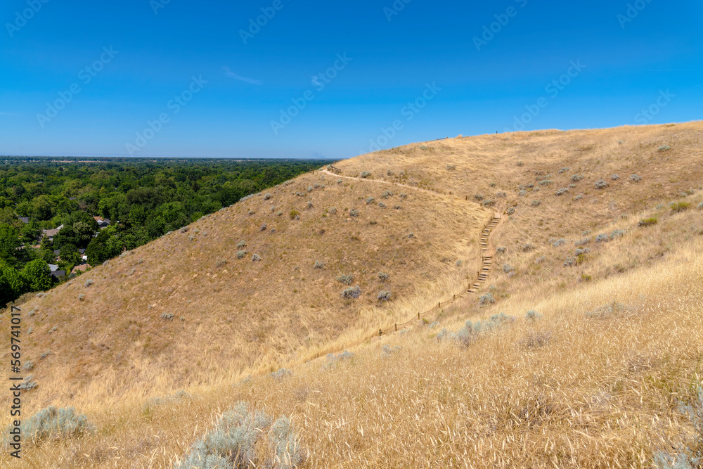 Trail on a mountain slope with grass in Boise, Idaho. Moutain trail ...