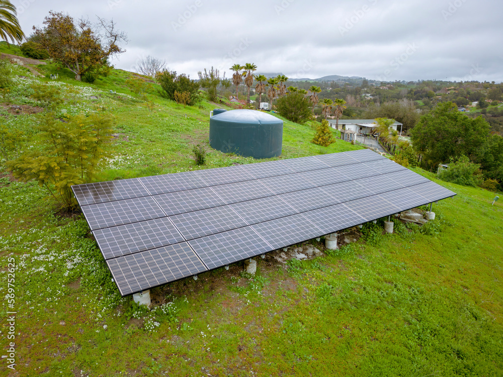 Fallbrook, California- Farm with solar panels and cistern tank on a ...