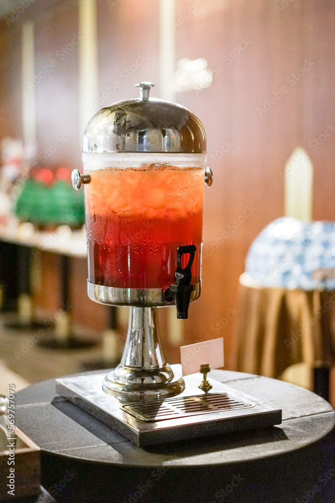 Black tea in dispensers on a self service breakfast counter in a hotel ...