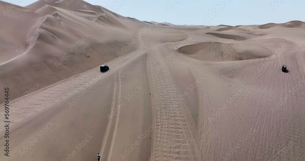 Dune buggies in Huacachina, Peru desert. Fast sand buggy driving on the ...