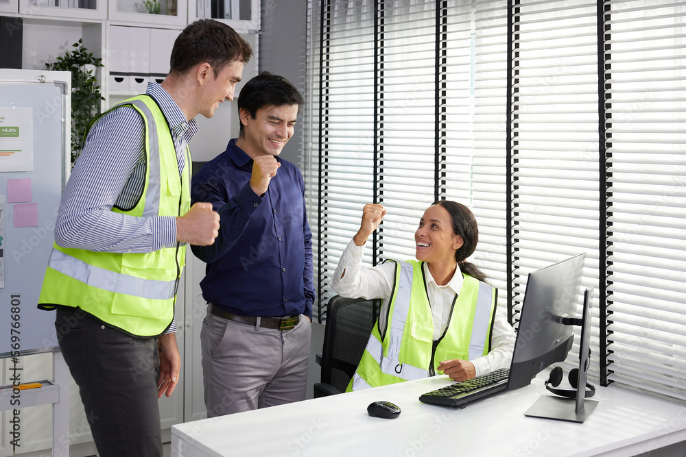 software engineers working on computer monitor and celebrating pose in ...