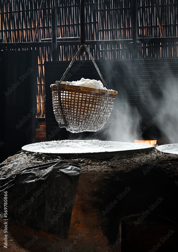 Close-up of ancient salting. The ancient method of boiling salt in a ...
