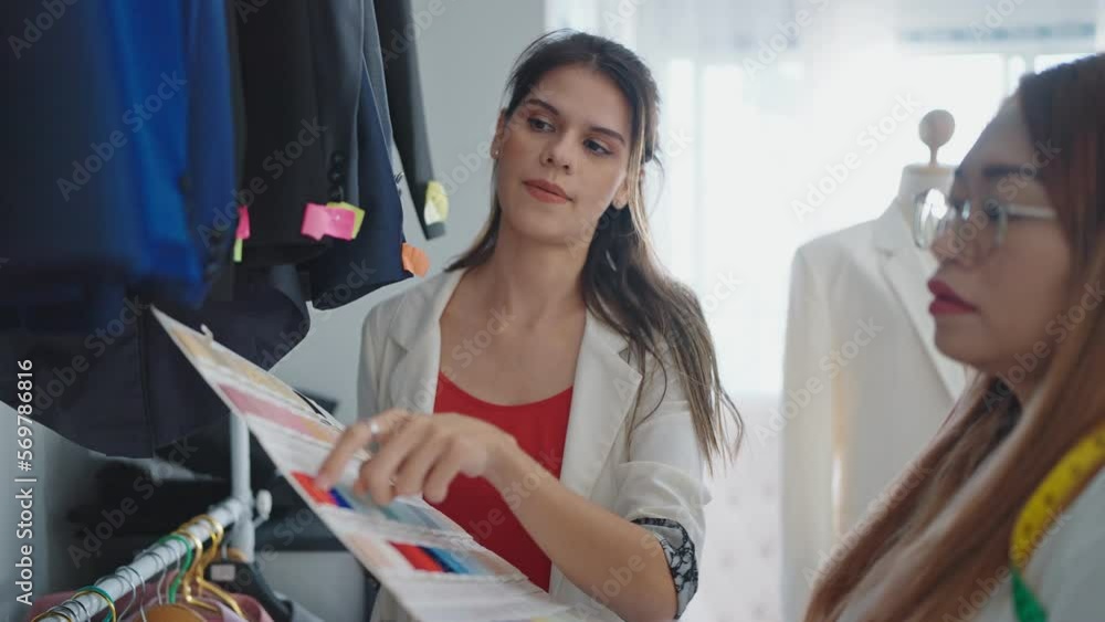 Beautiful asian woman professional fashion designer and assistant ...