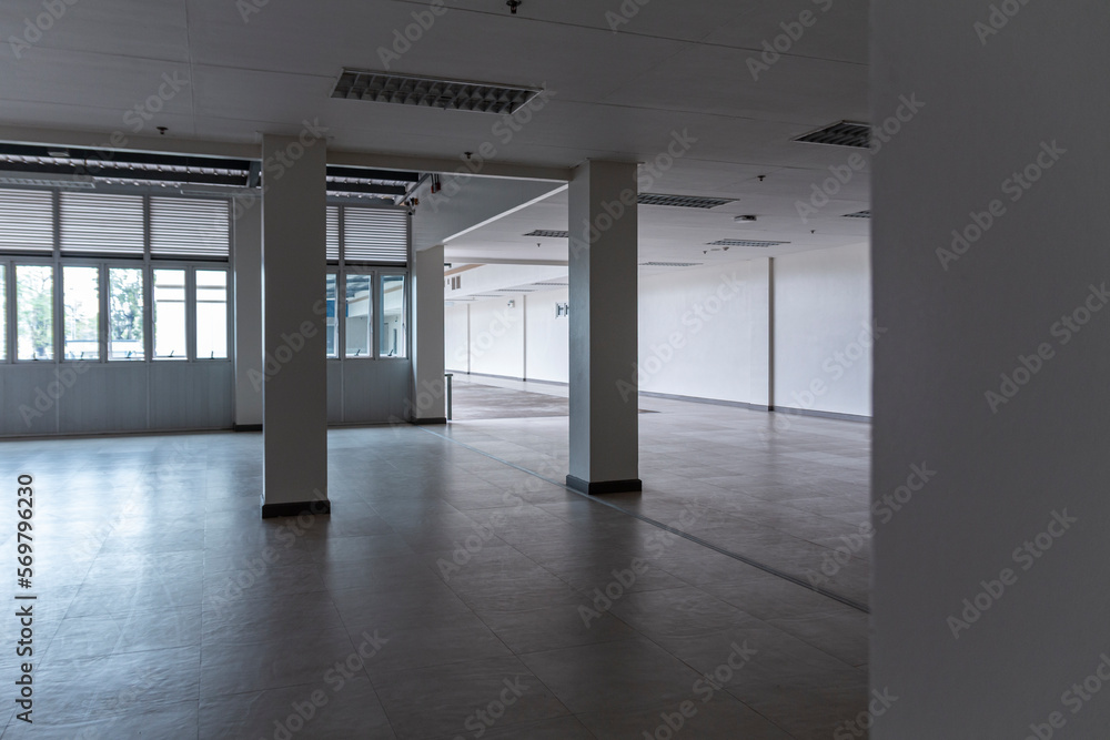 Inside the modern, all-white building, it was empty during the day ...