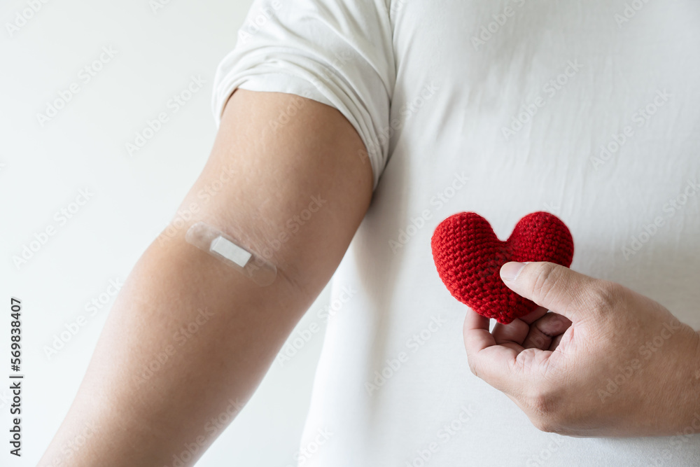 Foto de Concept of man with plaster giving blood donation to save ...