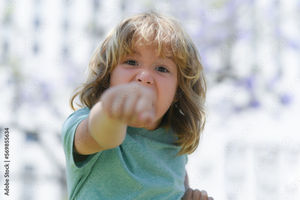 Boy fight with fist gesture punch. Child with angry expression. Angry ...