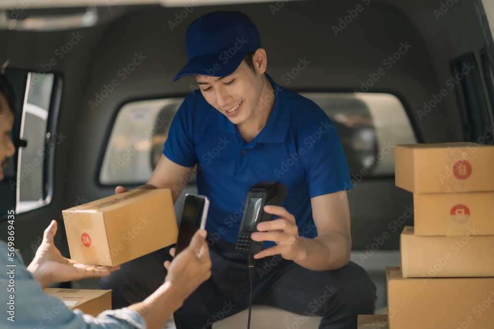 Asian delivery man, Hand using smart phone to scan QR code on tag ...