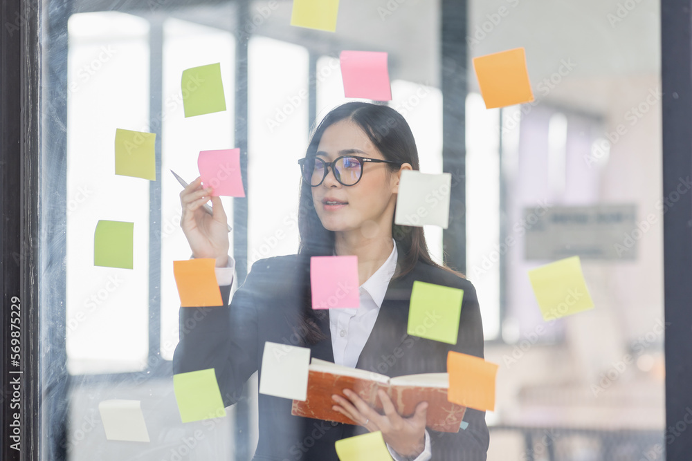 Business female employee with many conflicting priorities arranging ...